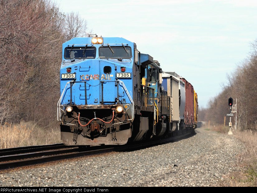 CSX 7305 leads Westbound CSX Q371 at MP 105.2 on track number two.
